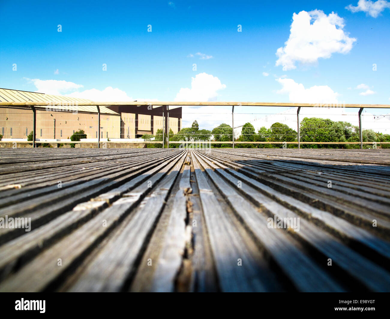 Timber decking surface with metal handrail Stock Photo - Alamy