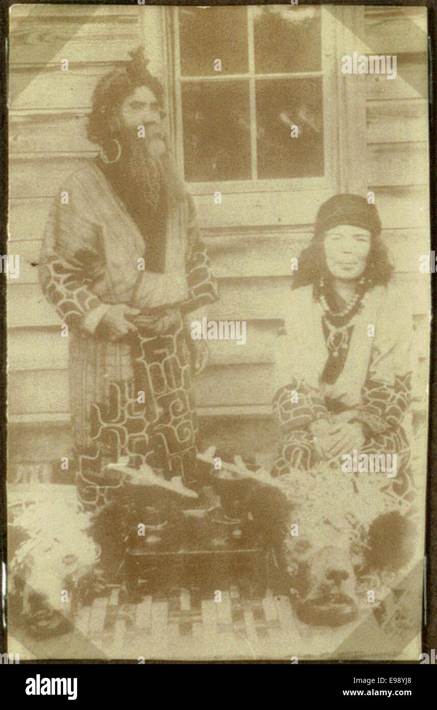 Photograph of a traditional Ainu couple from Japan. The image captures ...