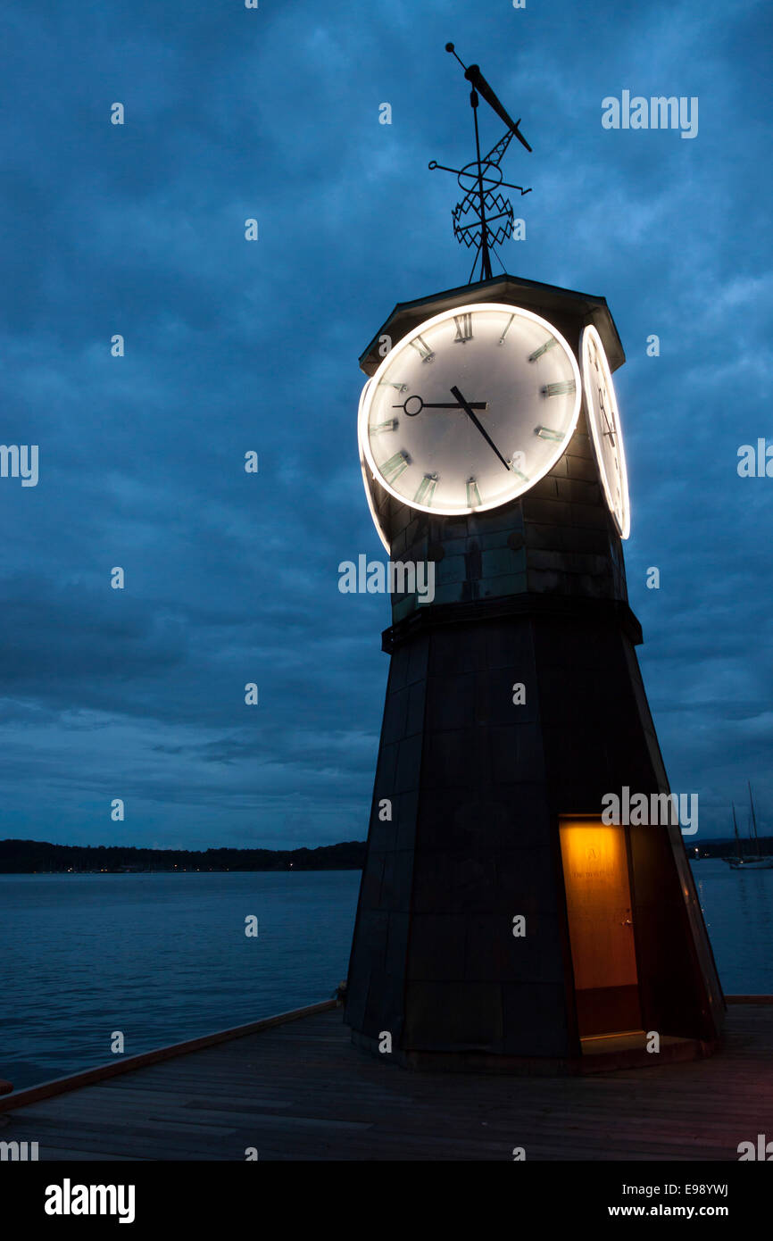 Magical light of the clock tower at mystic dusk in harbor. Oslo ...