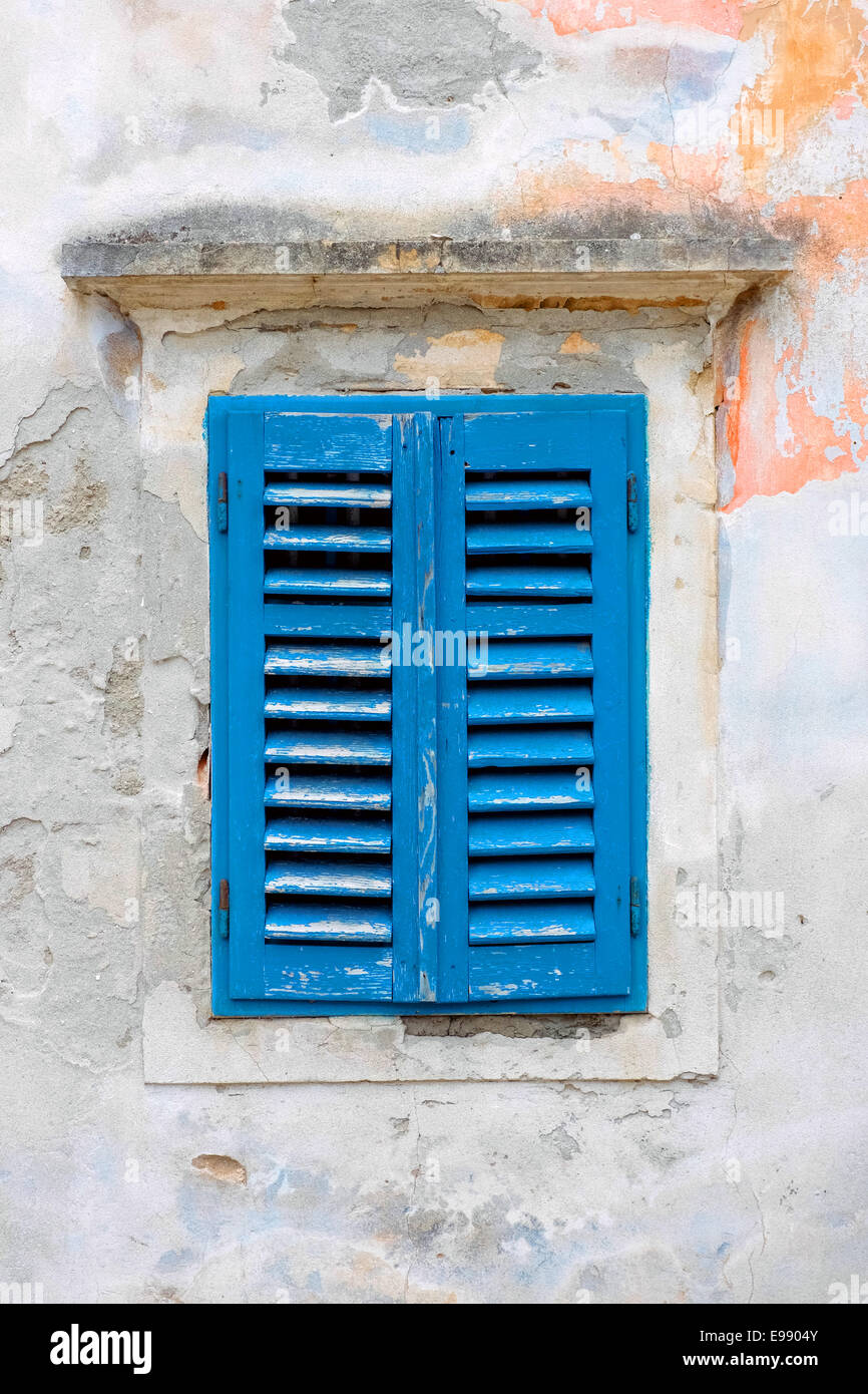 Old window with blue shutters Stock Photo - Alamy