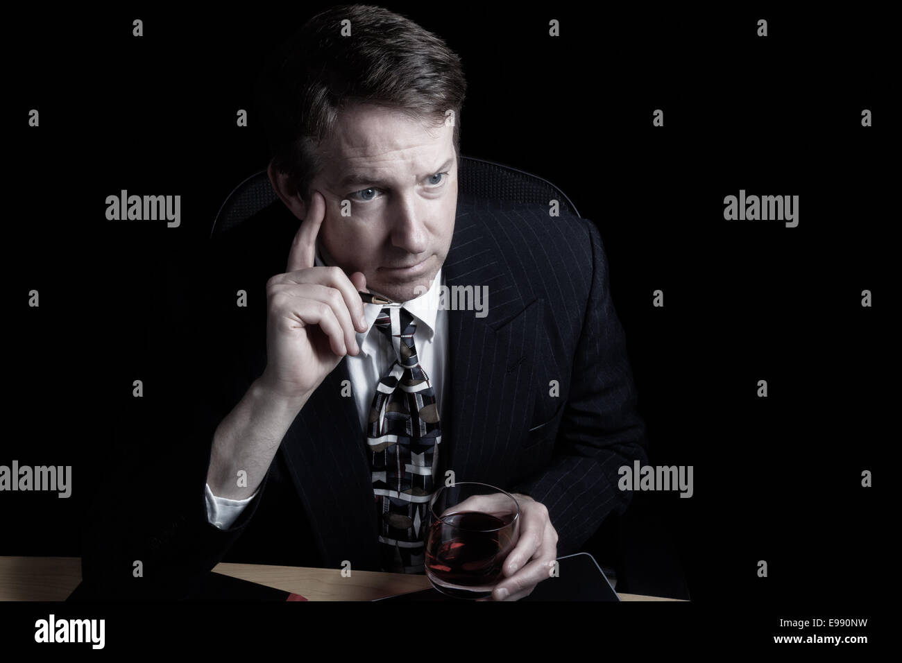 Horizontal image of business man working late with black background ...