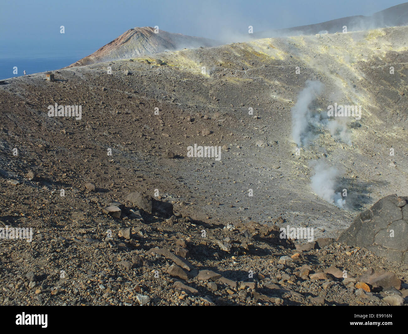 Crater rim and slopes are covered with stones and larger rocks. The ...