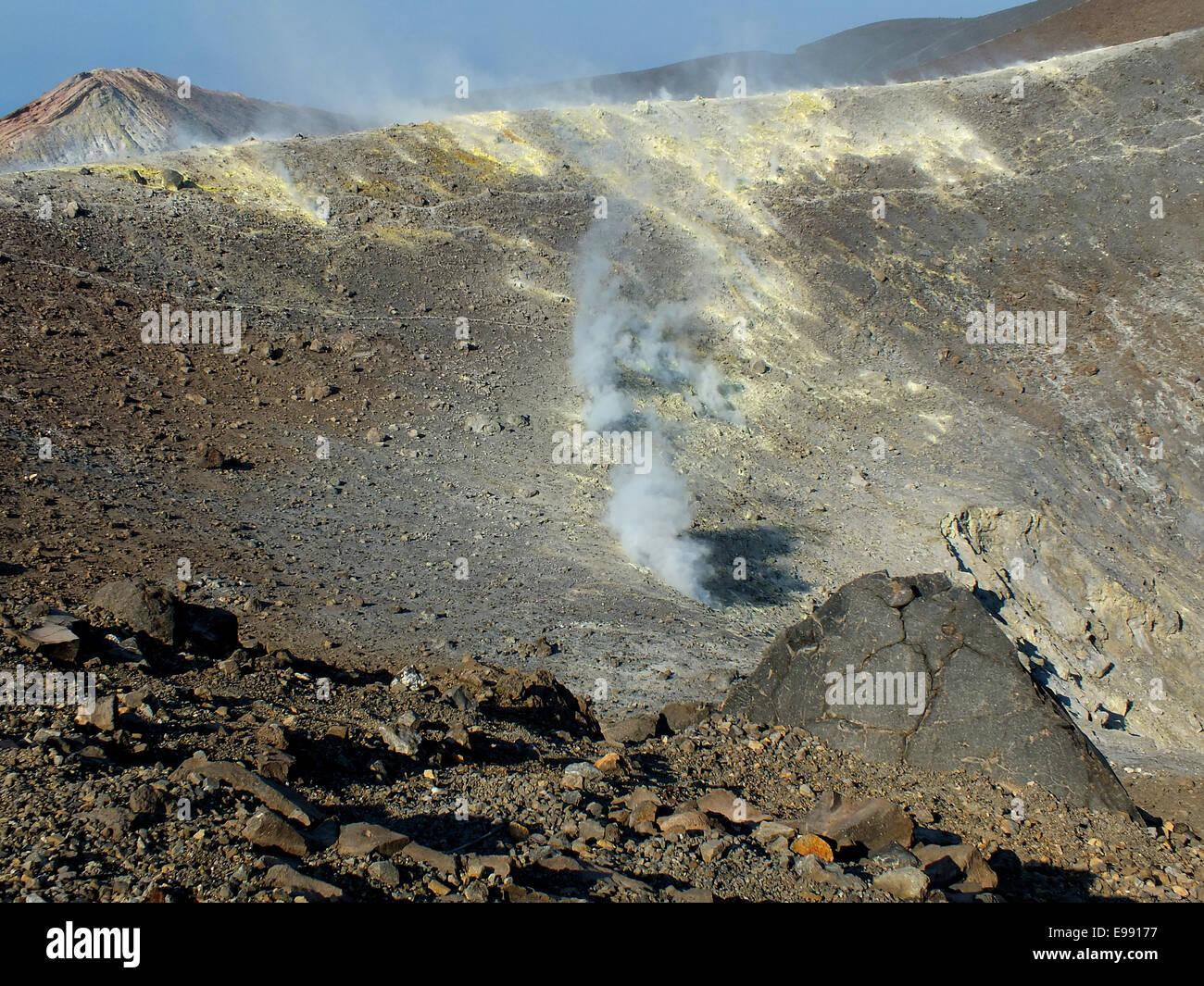 Crater rim and slopes are covered with stones and larger rocks. The ...