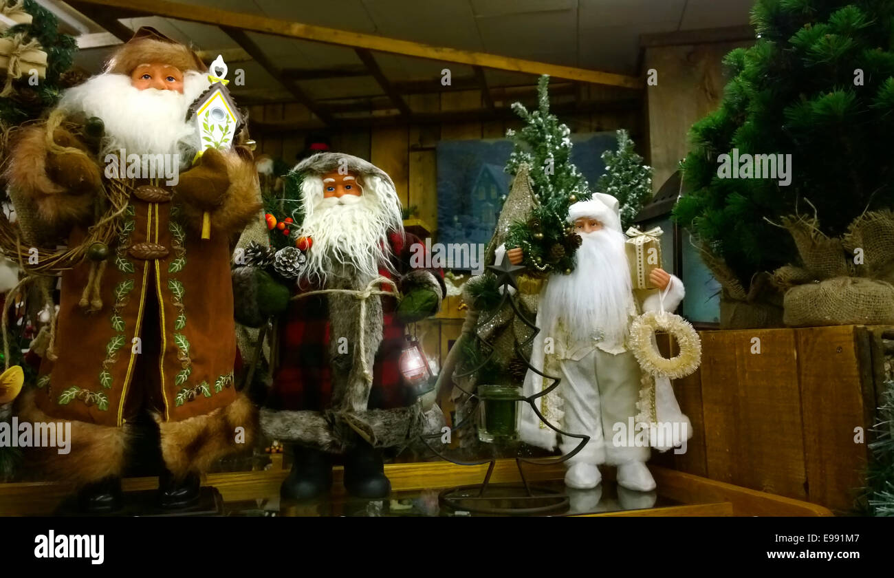 three Santa Claus decorations Stock Photo - Alamy