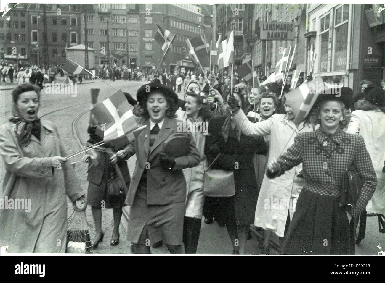 A historic photograph capturing people celebrating the liberation of ...