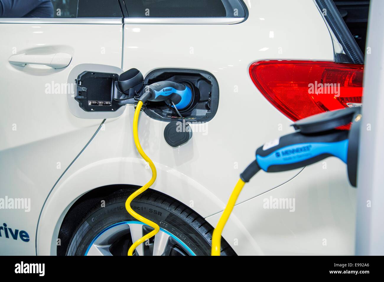 Electric car being charged at a loading station Stock Photo - Alamy