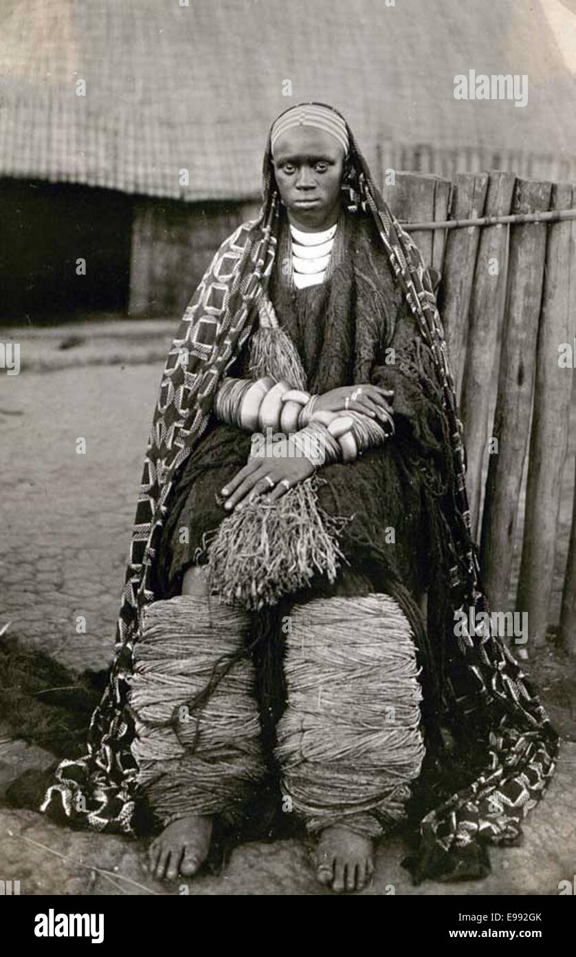A photograph from 1928 showing a native woman sitting in front of a ...