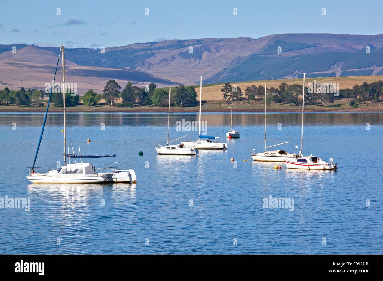 Landscape view of mountains overlooking idle yachts anchored in Midmar ...