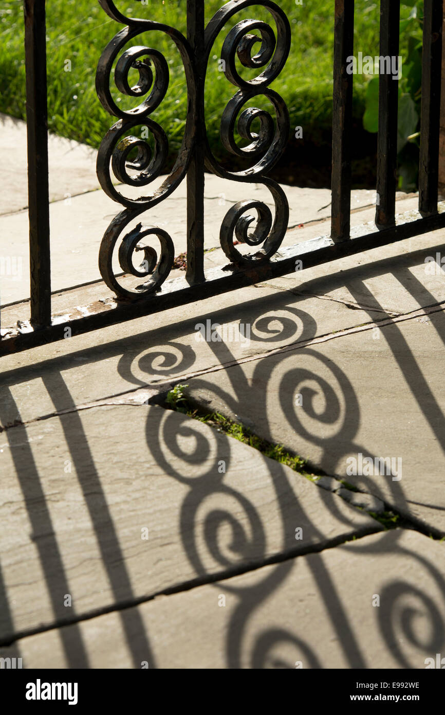 Iron gate and shadow Stock Photo - Alamy