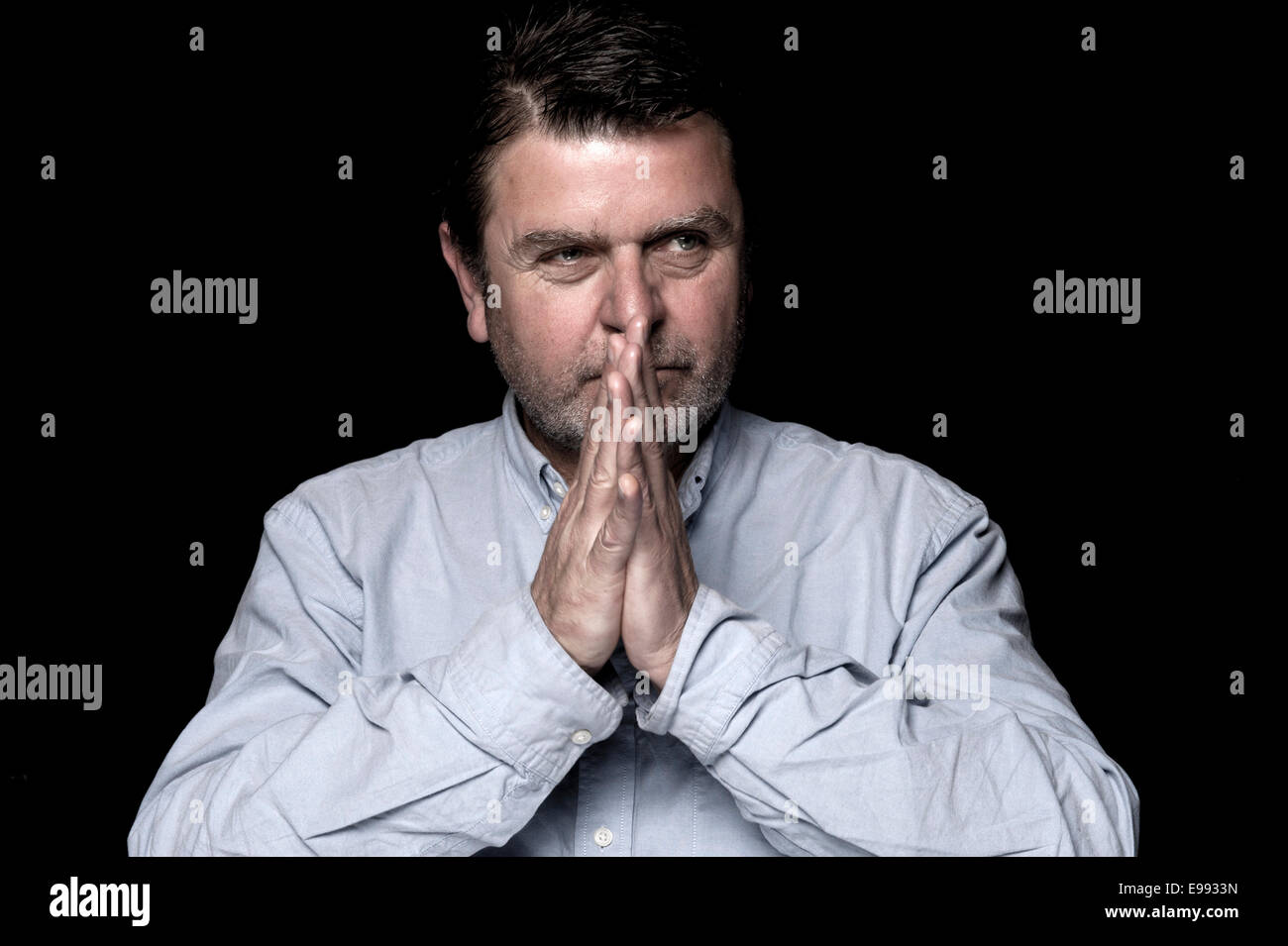 actors getting into character backstage against a black background ...