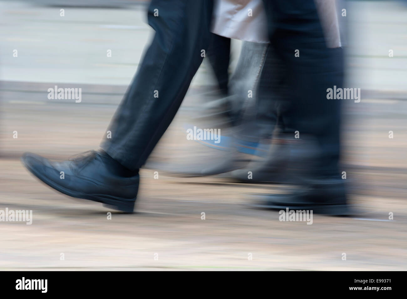 People walking in a street, motion blur Stock Photo - Alamy