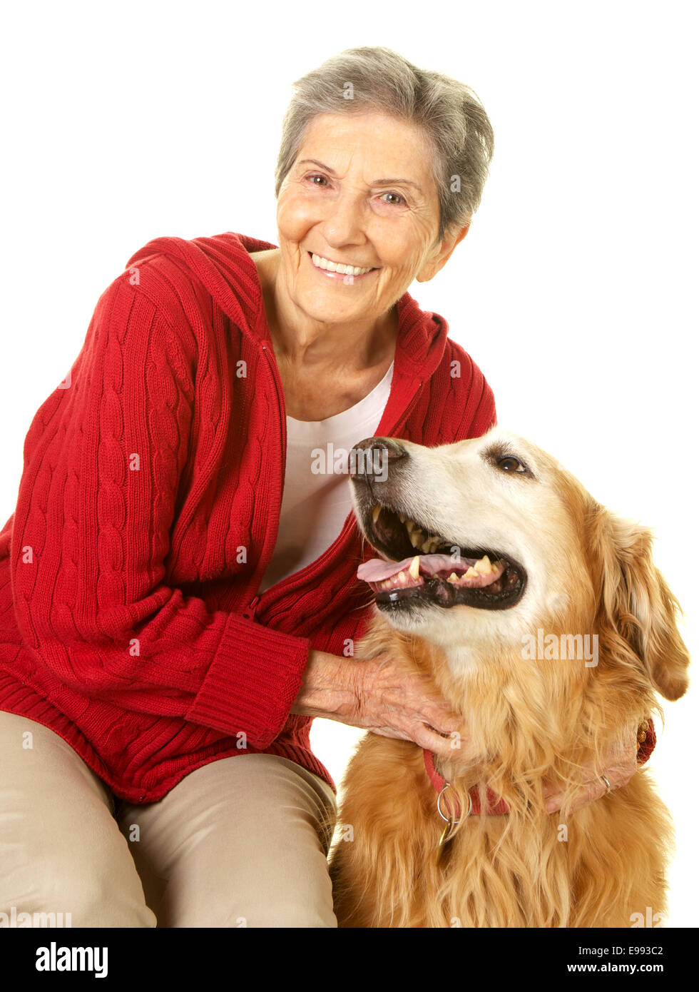 A Vibrant Happy Senior Woman and Her Golden Retriever Dog on a White ...