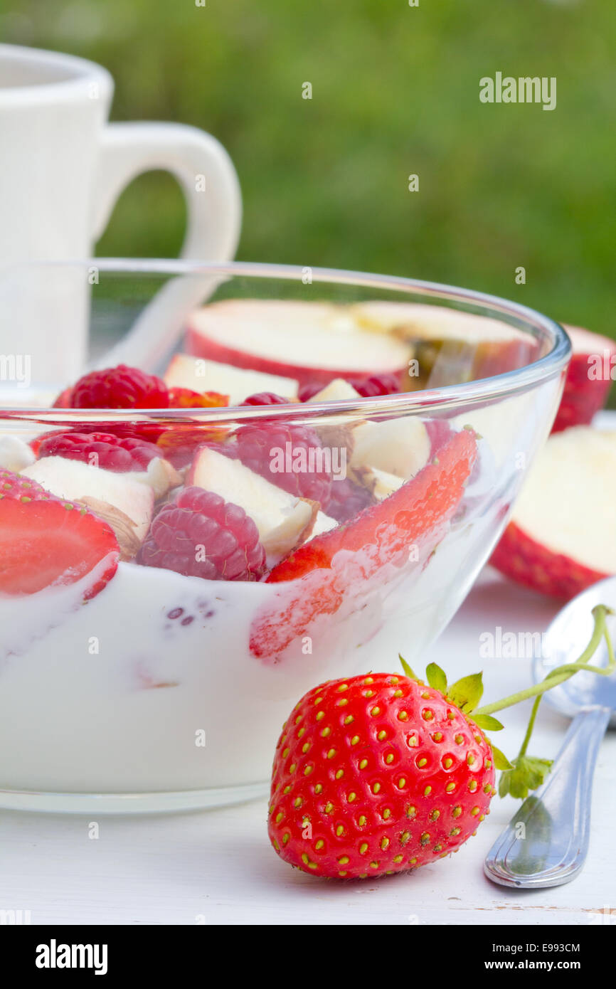 Raspberries, strawberries and apples with yogurt Stock Photo - Alamy