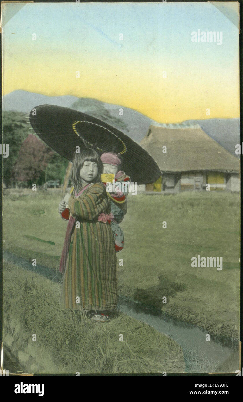 A photograph of a little girl carrying a child on her back in Japan ...