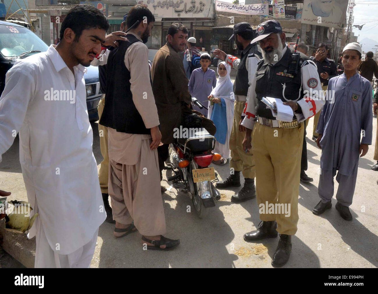 Police official taking off vehicle registration number plate during ...