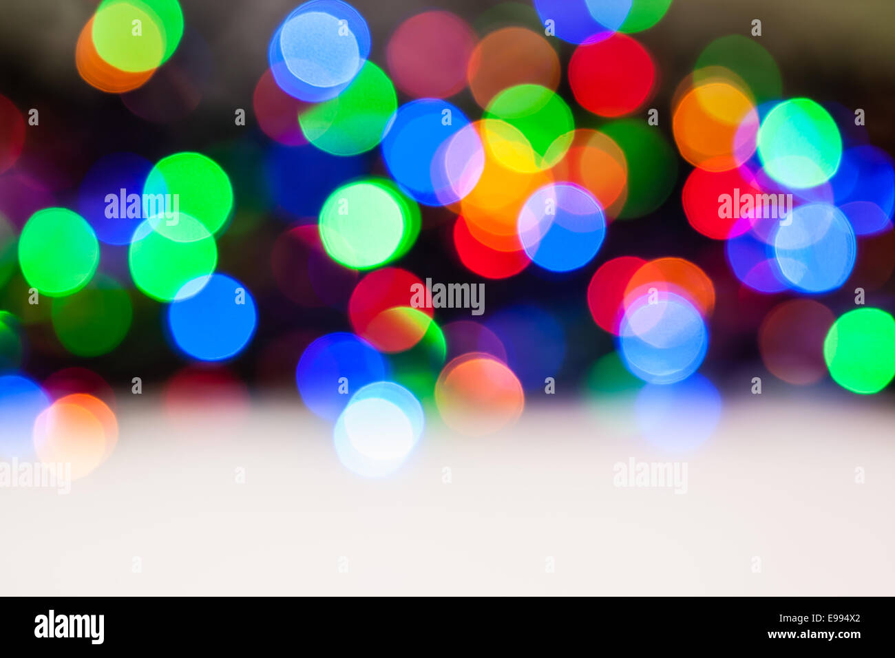 A bright multicolor bokeh background created by a set of defocused ...