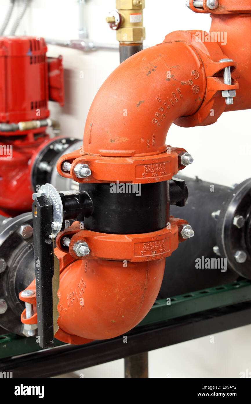 Plumbing fittings in a geothermal energy heated building Stock Photo ...
