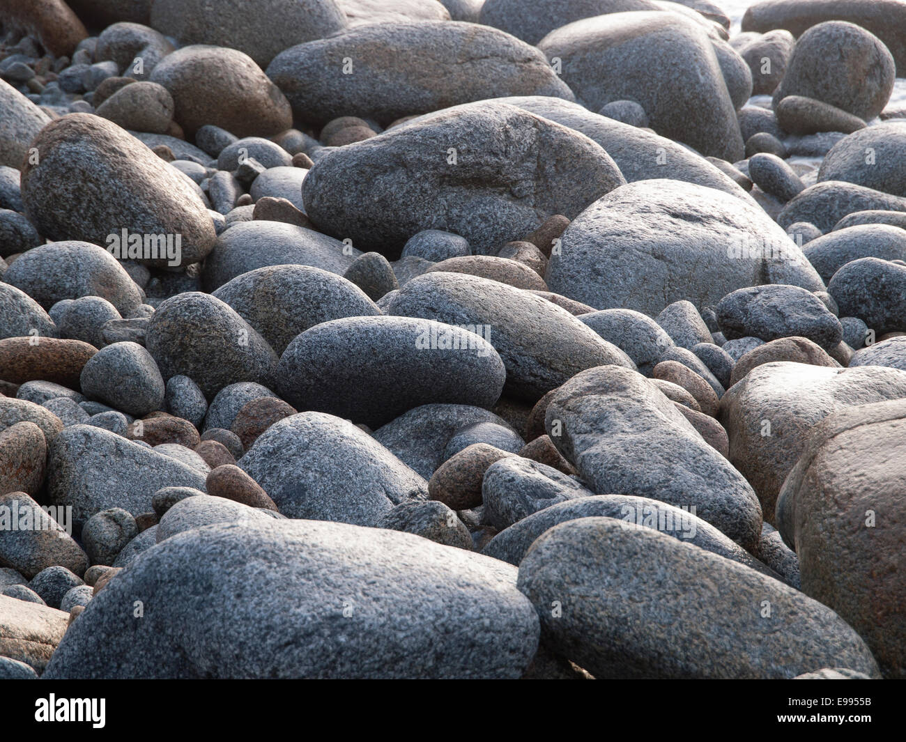 Pebbles background detail in the beach outdoors Stock Photo - Alamy