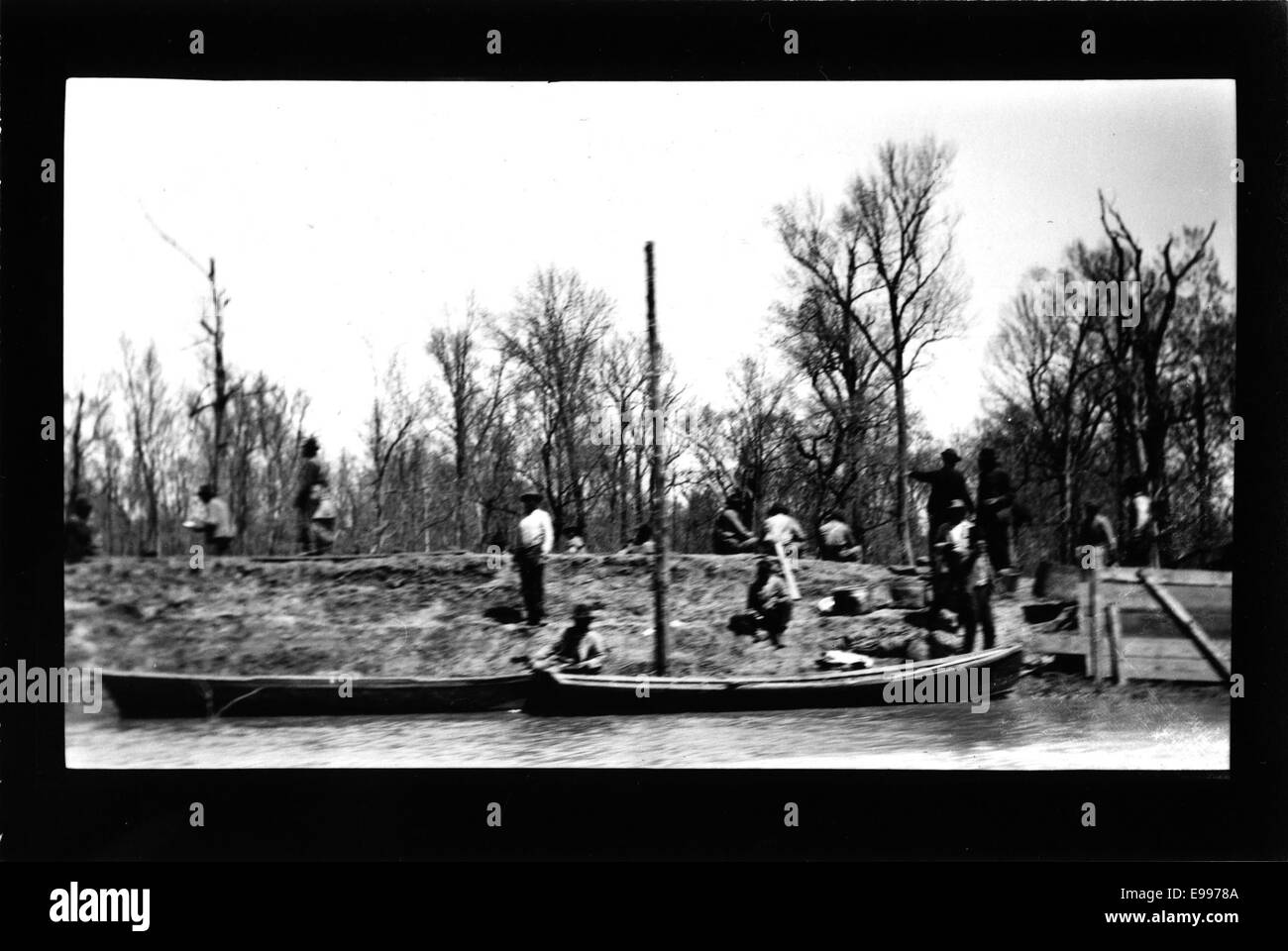 A historical photograph depicting workers constructing or maintaining a ...