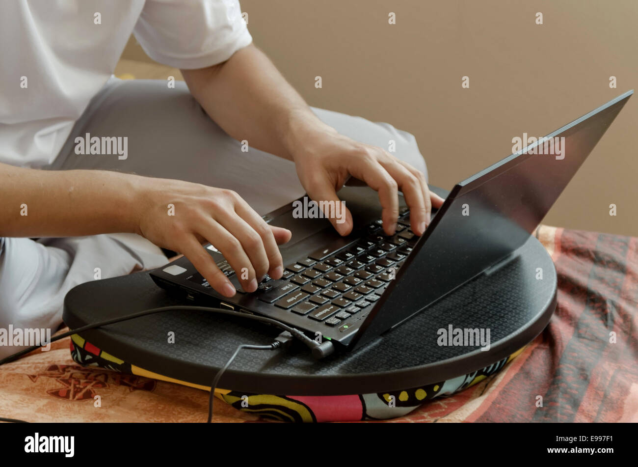A businessman working on a laptop computer in home Stock Photo - Alamy