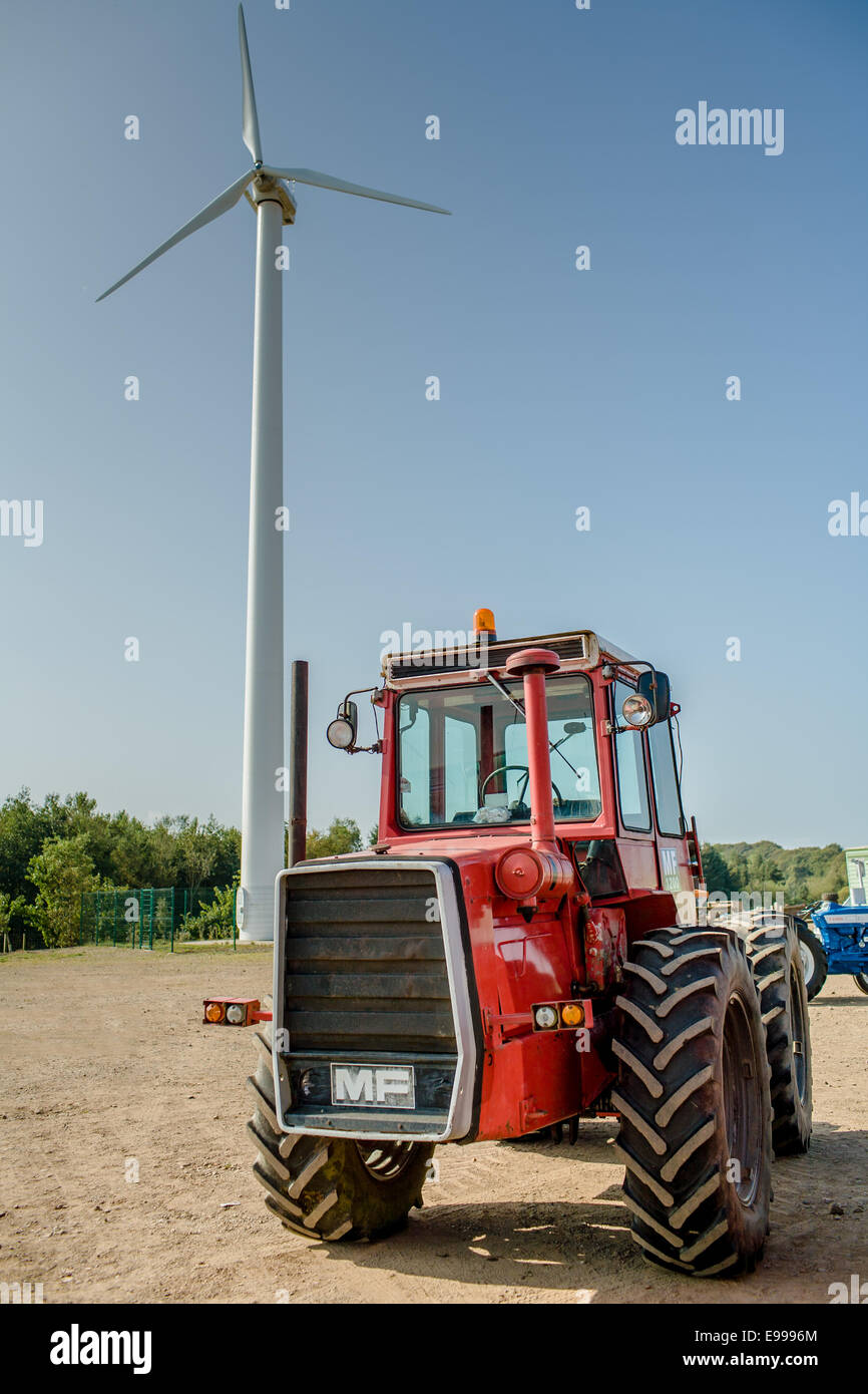 Rare 4x4 Massey Ferguson red giant tractor with wind turbine in yard on ...