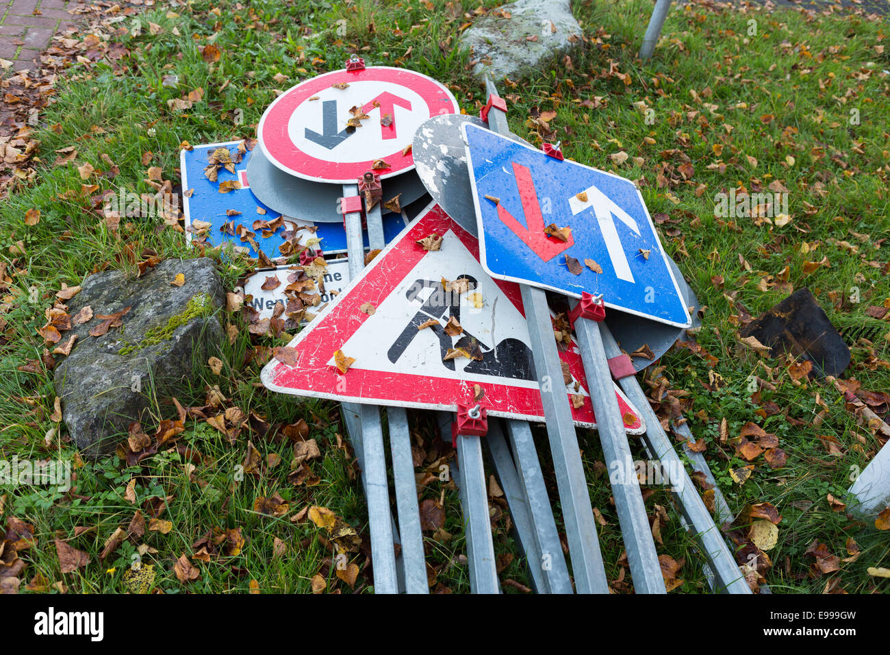 A pile of metal road signs lying on the ground Stock Photo - Alamy