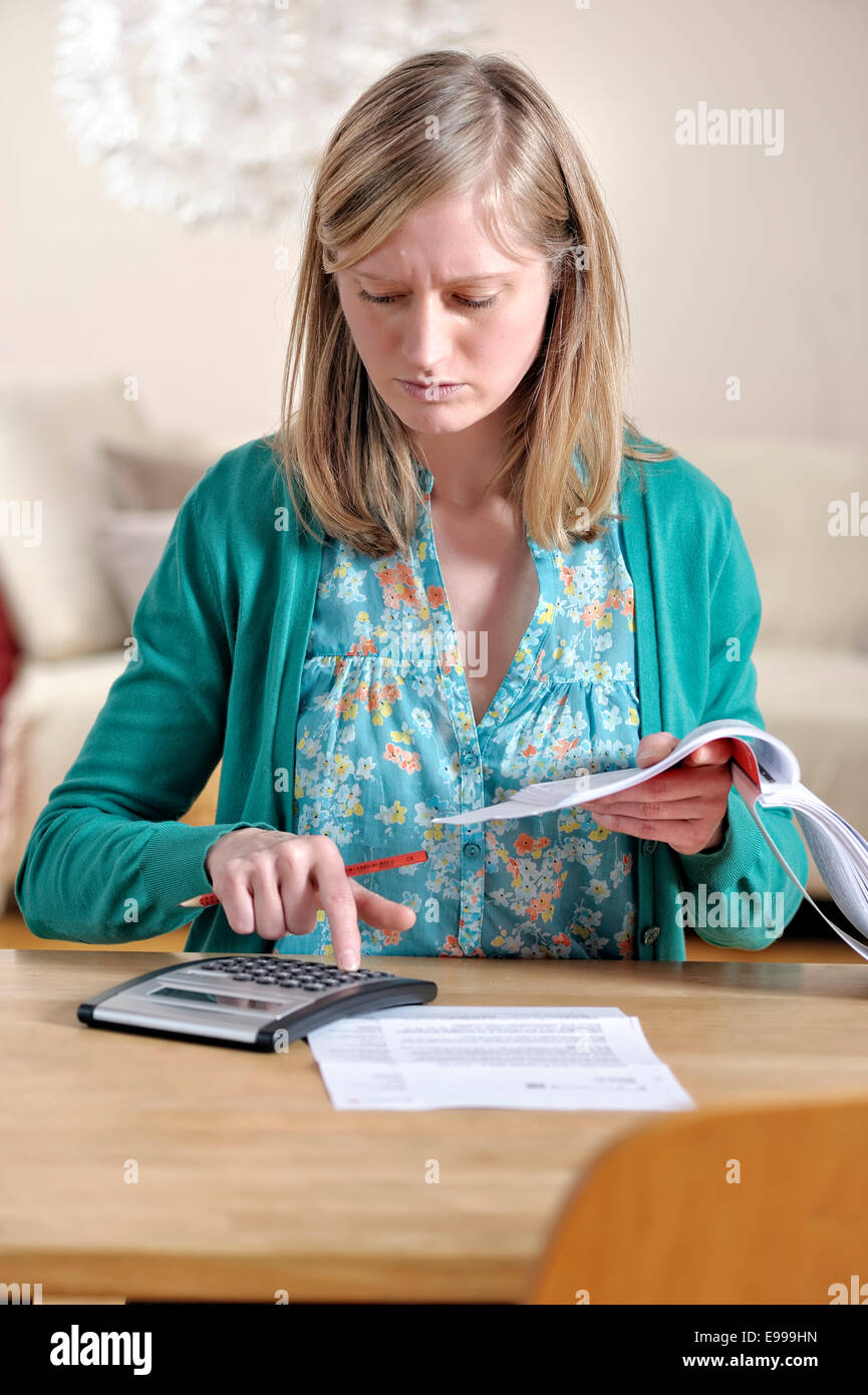 Woman desk calculating receipts hi-res stock photography and images - Alamy