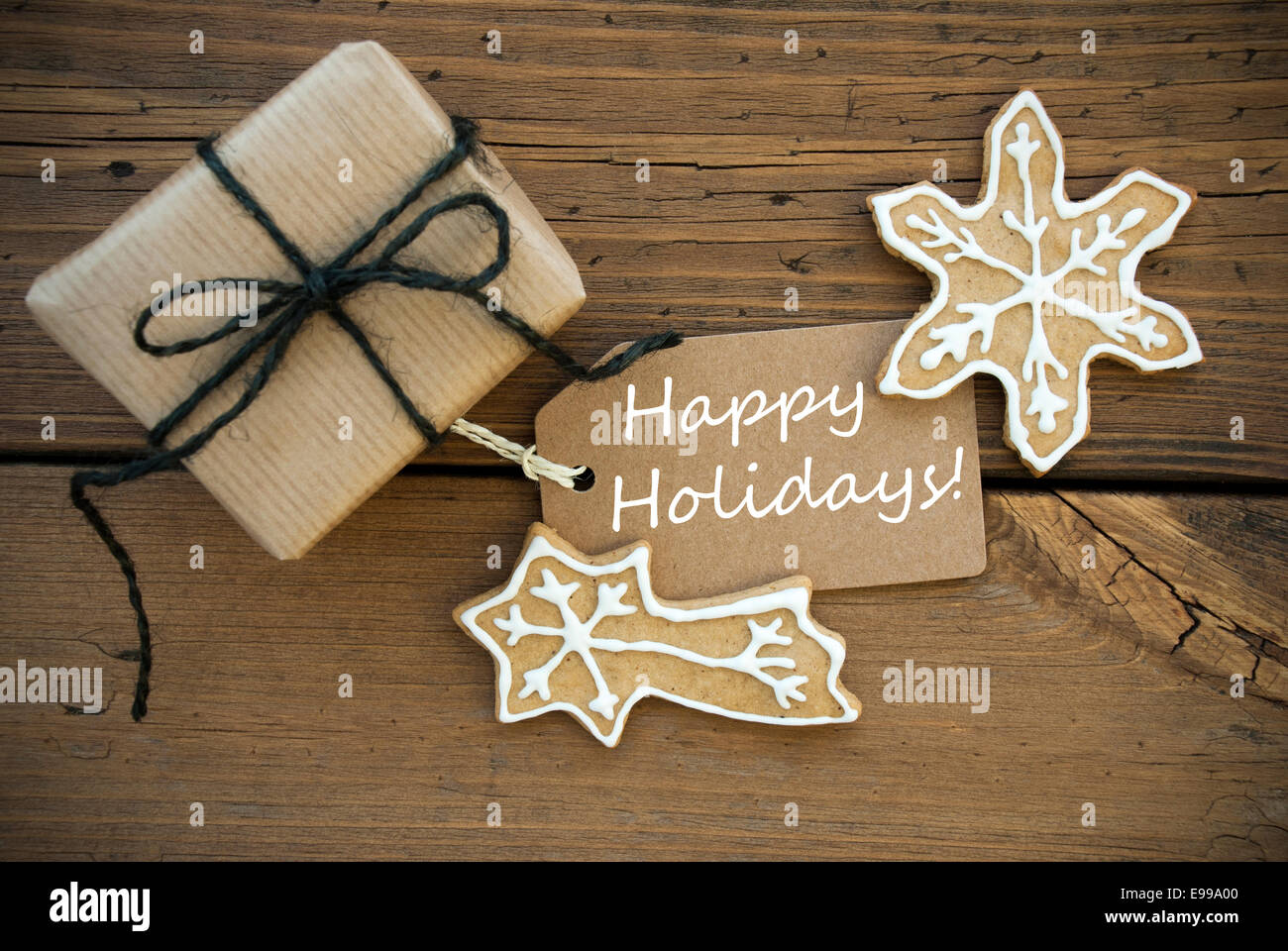 White Happy Holidays on a brown Banner with Ginger Bread Cookies and a ...