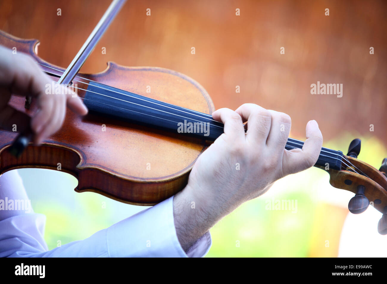 Detail of violin being played by a musician Stock Photo - Alamy
