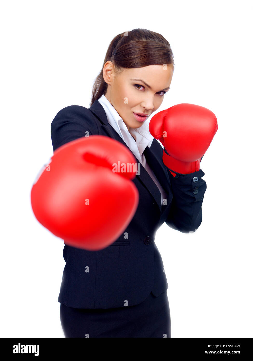 Determined businesswoman throwing a punch Stock Photo - Alamy