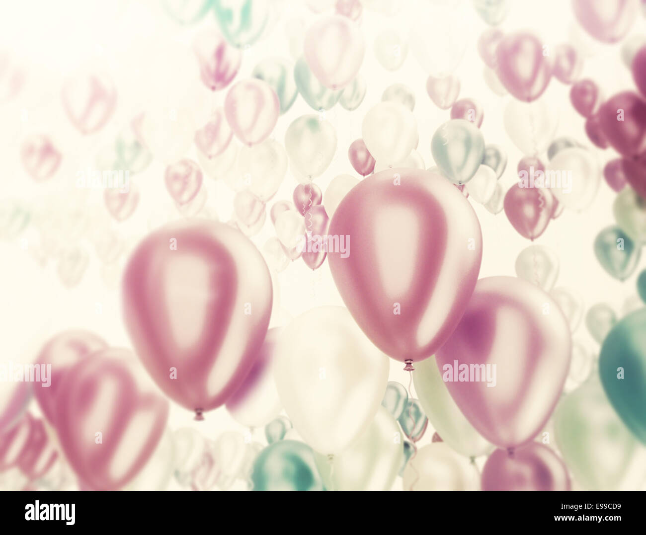 Group of multi color party balloons on white background Stock Photo - Alamy
