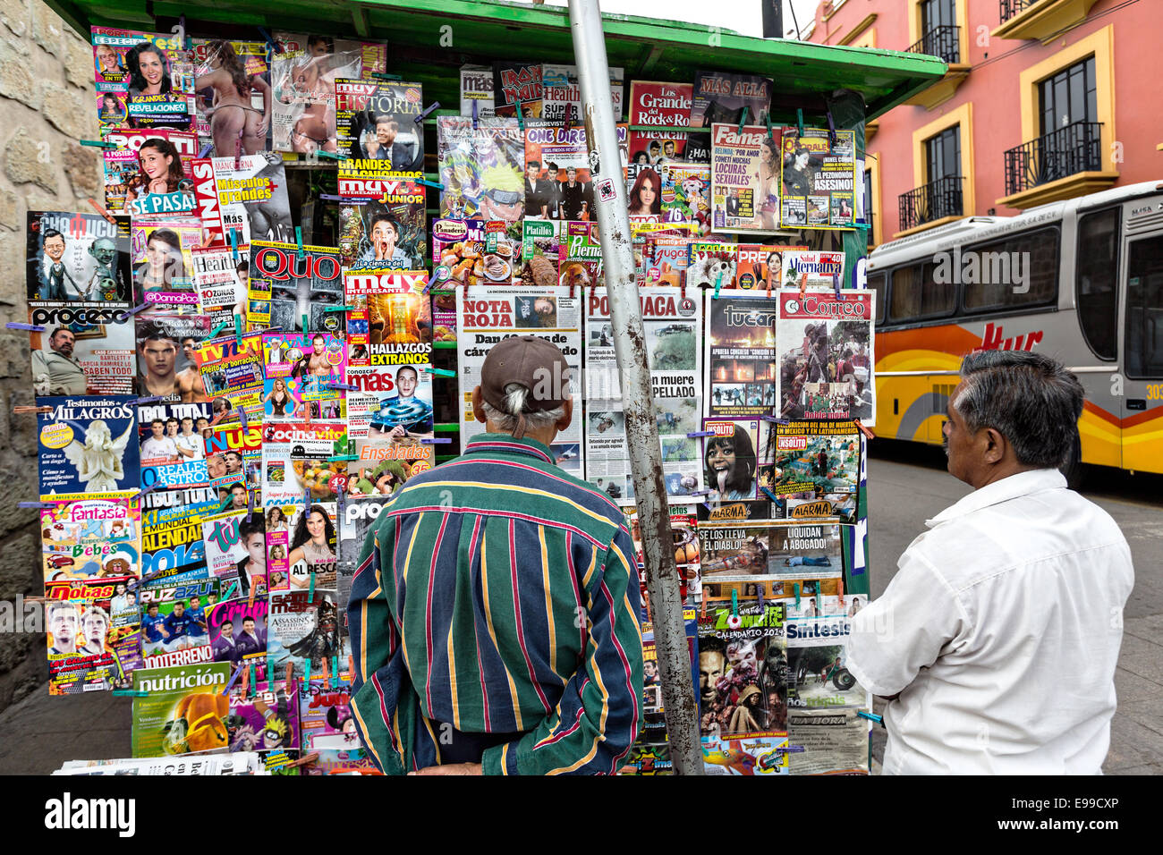 Mexicans stop to read magazines at a news stand October 31, 2013 in ...