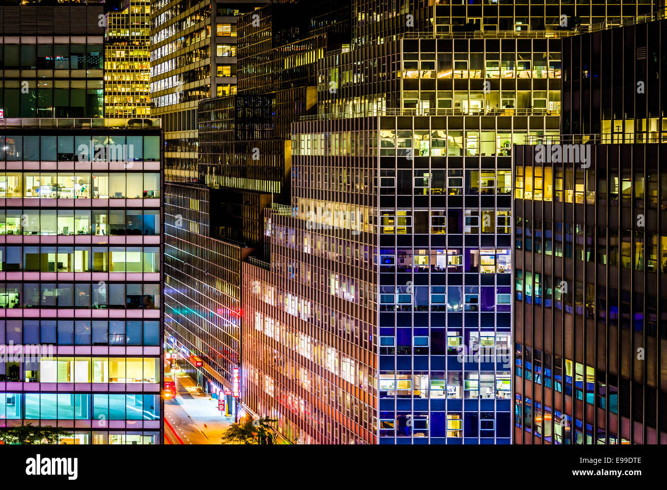 View of modern architecture along 51st Street at night, in Manhattan ...