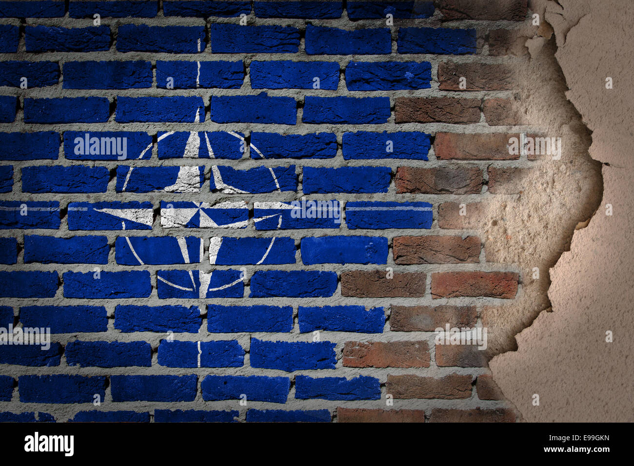Dark brick wall texture with plaster - flag painted on wall - NATO ...