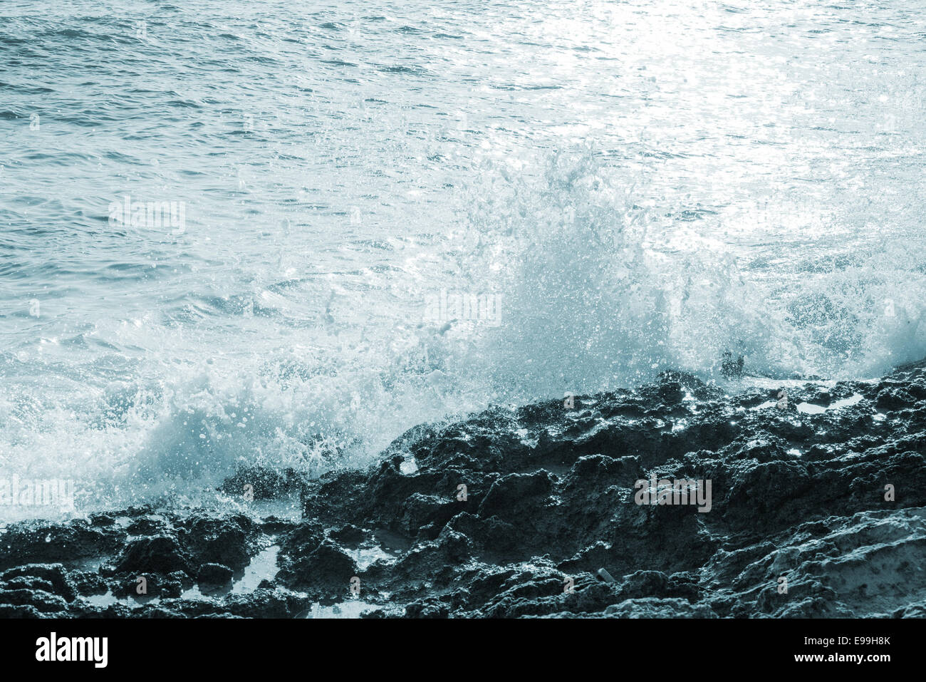 Big windy waves splashing over rocks. Storm begins Stock Photo - Alamy