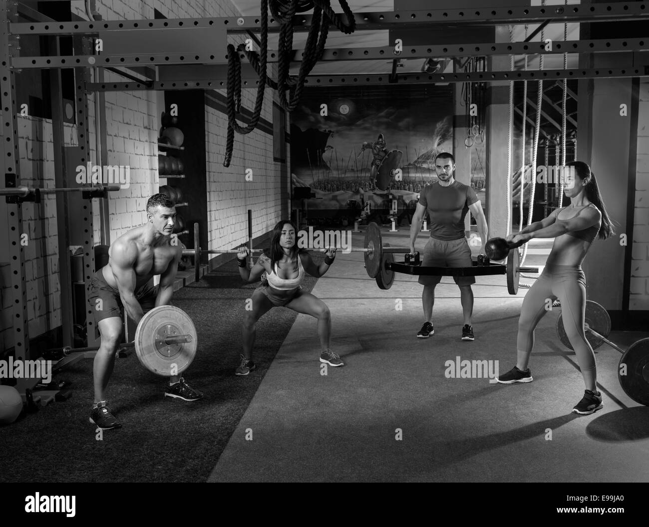 gym group weight lifting workout men and girls exercise Stock Photo - Alamy