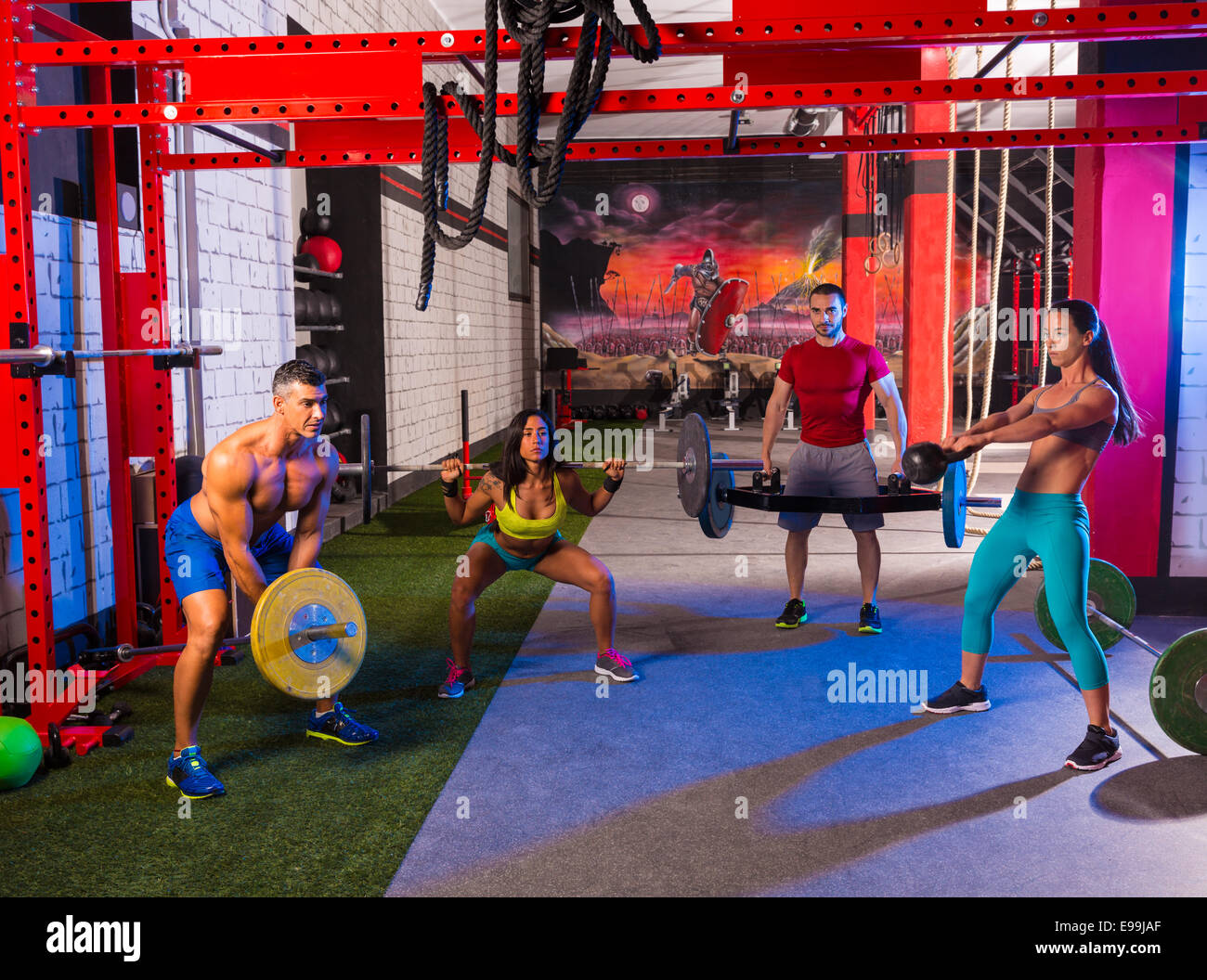 gym group weightlifting workout men and girls exercise Stock Photo - Alamy
