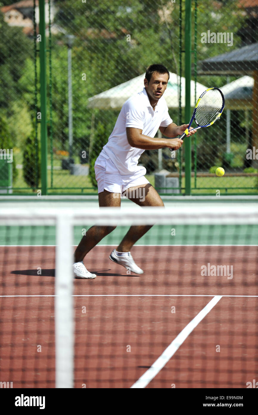young man play tennis outdoor Stock Photo - Alamy