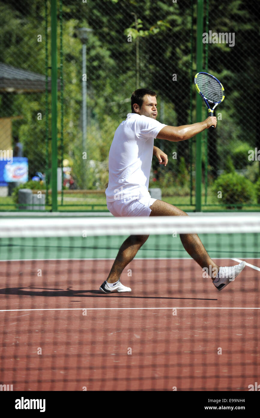 young man play tennis outdoor Stock Photo - Alamy