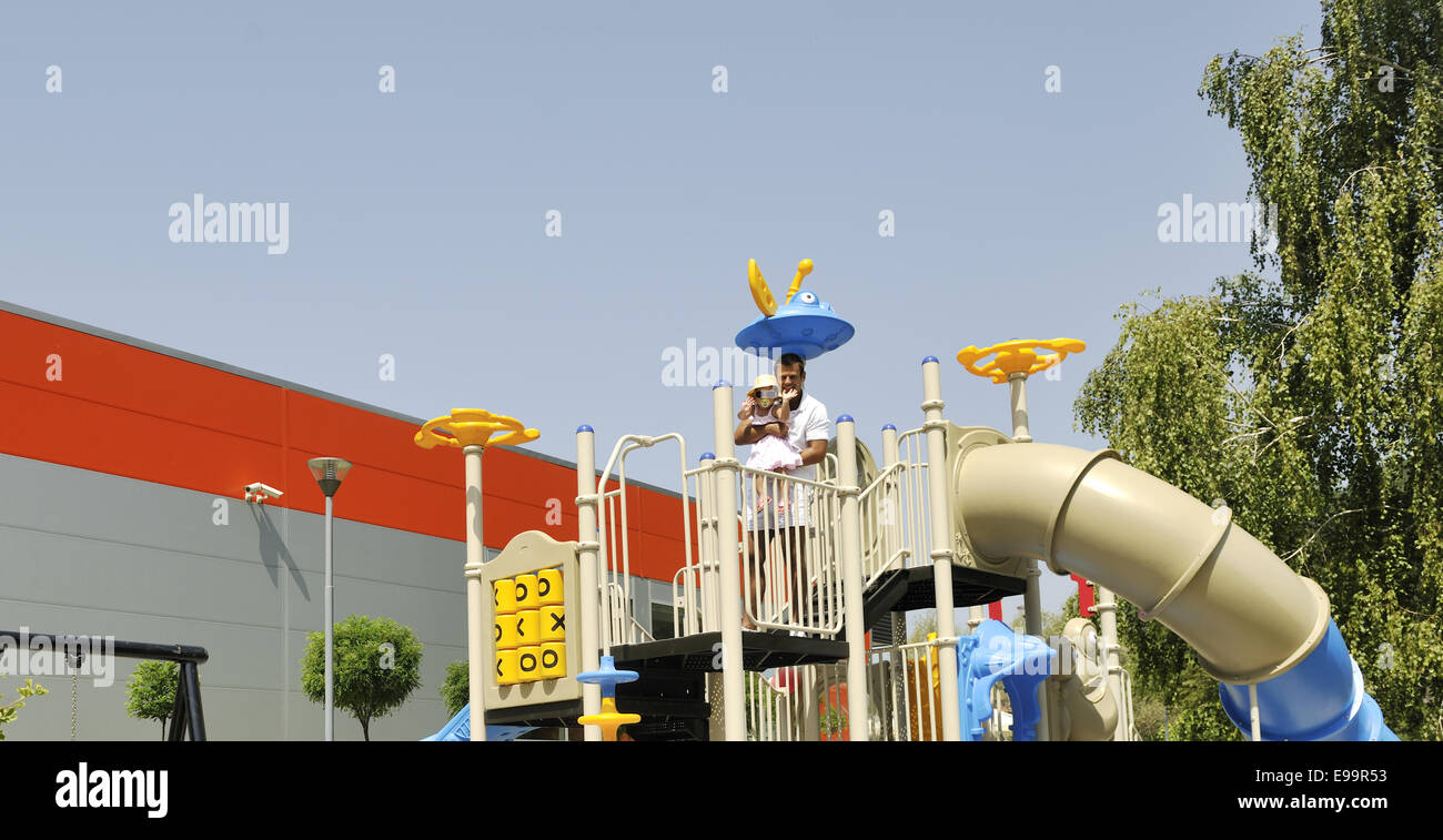 family portrait at park playground Stock Photo - Alamy