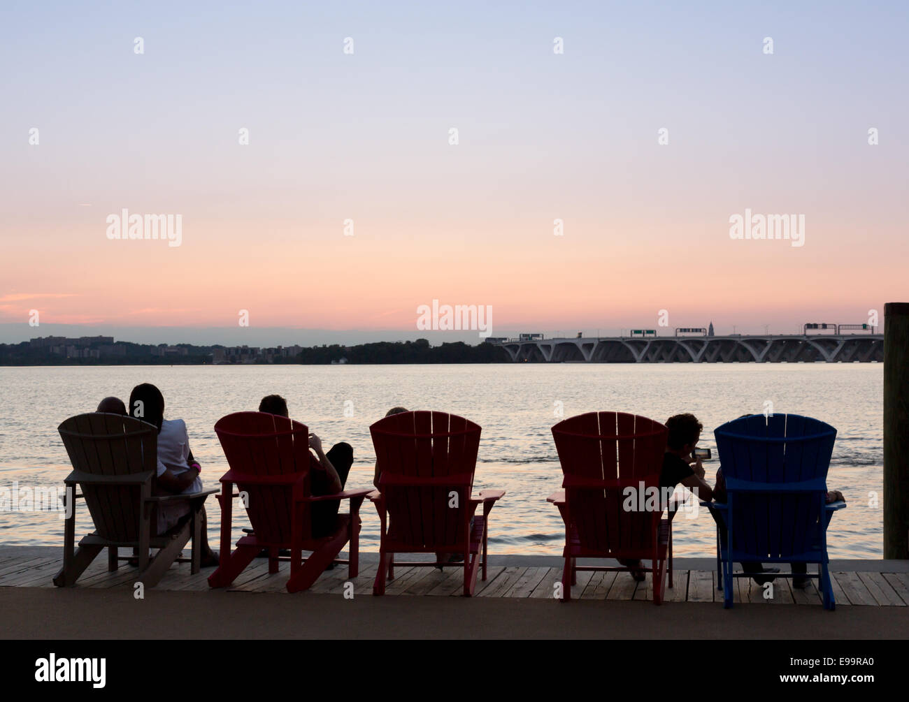 Tourists watch sunset from National Harbor Stock Photo - Alamy
