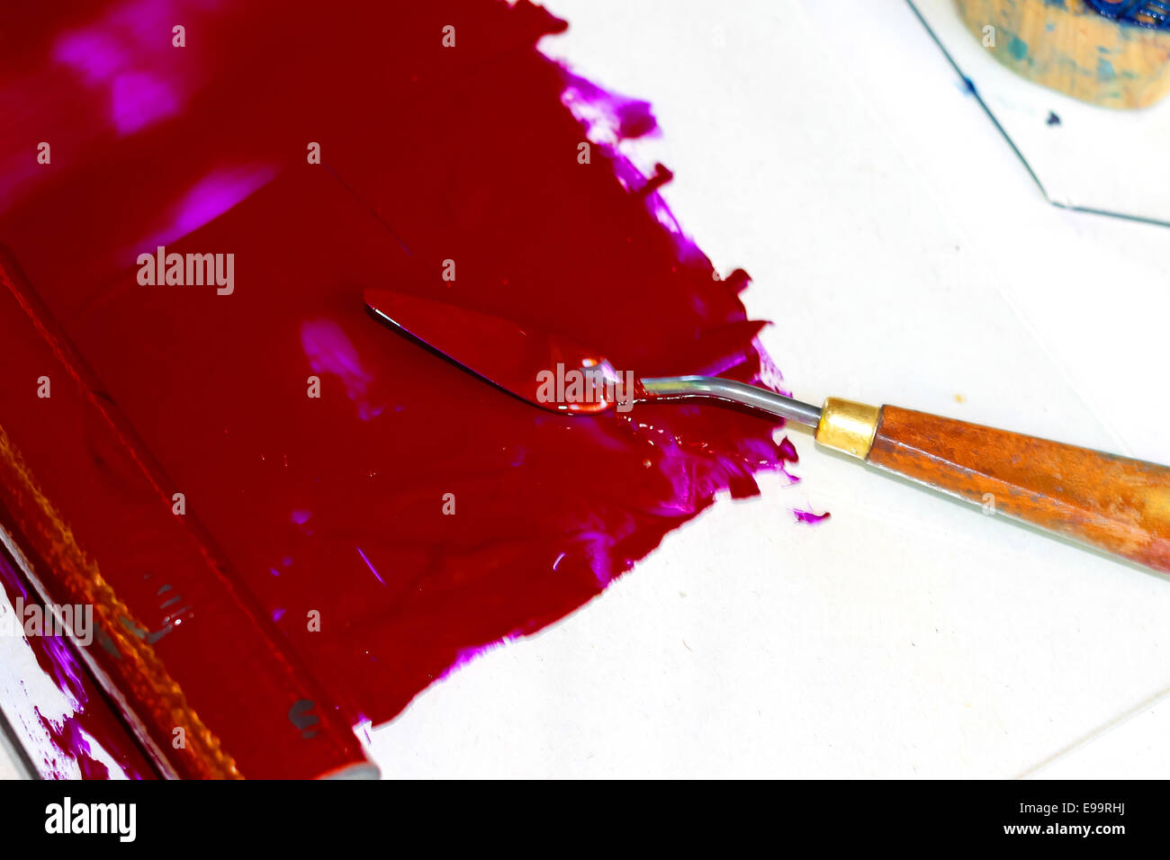 The paint and trowel for printing on cloth Stock Photo - Alamy