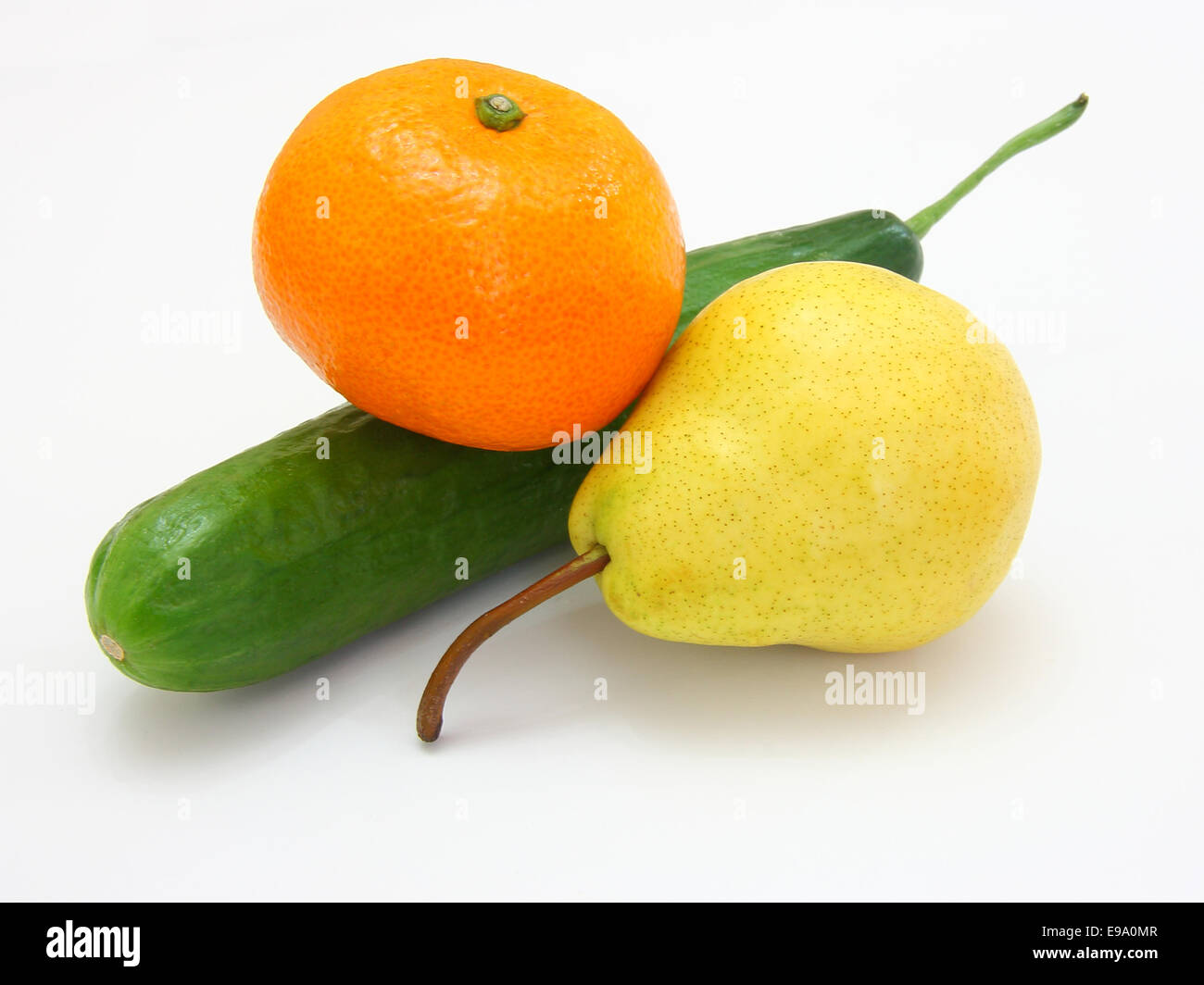 cucumber with a tangerine and a pear Stock Photo - Alamy