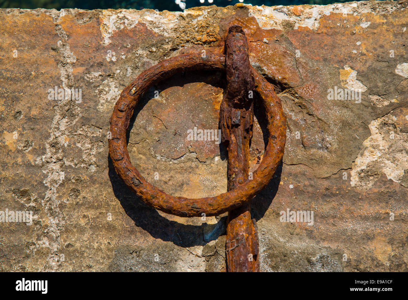 old weathered steel rings in harbor Stock Photo - Alamy
