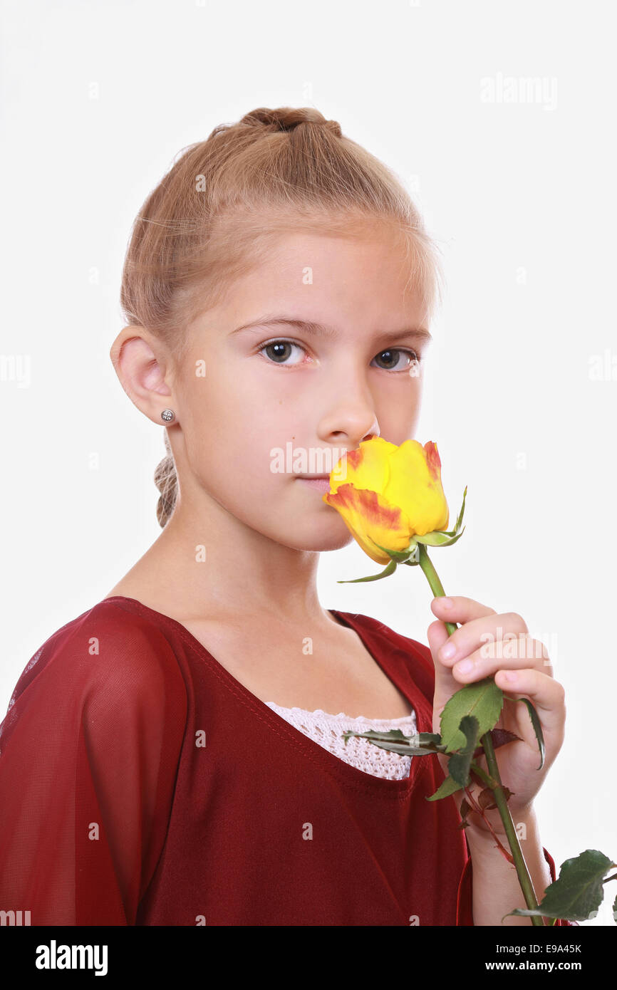 Thoughtful girl with a rose in his hand Stock Photo - Alamy