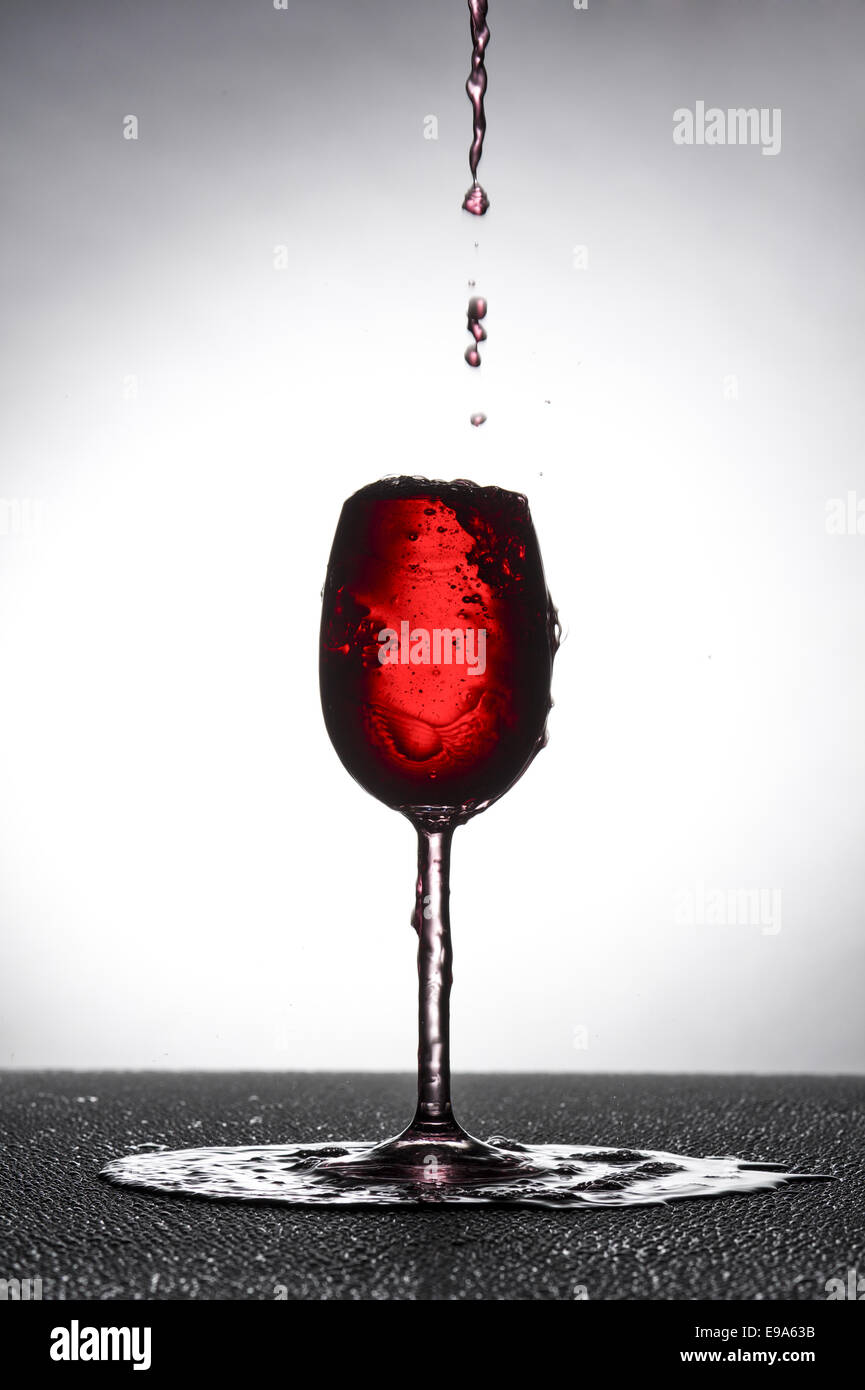 Overflowed into wine glass Stock Photo - Alamy