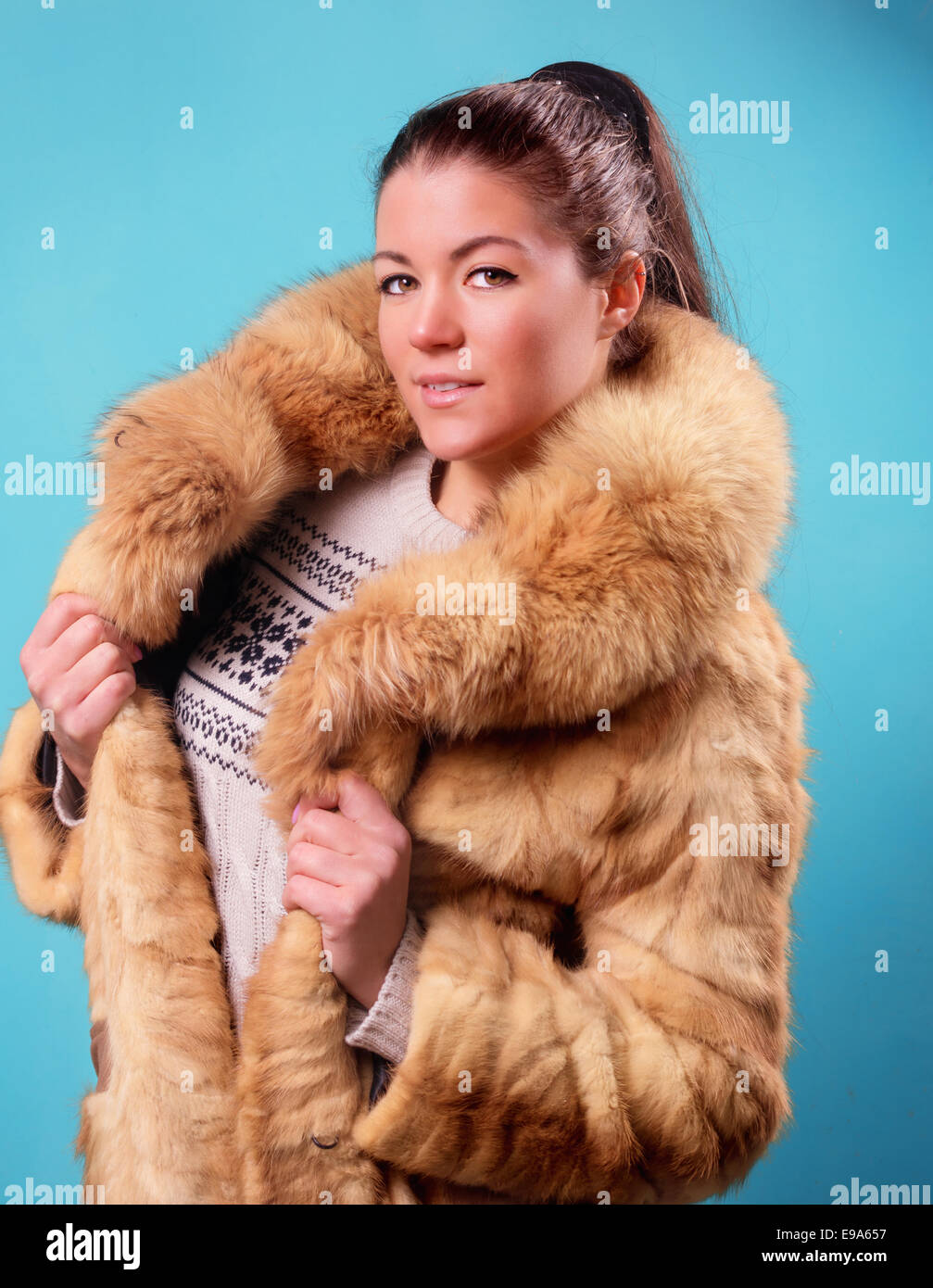 Beautiful woman in a fur coat Stock Photo - Alamy