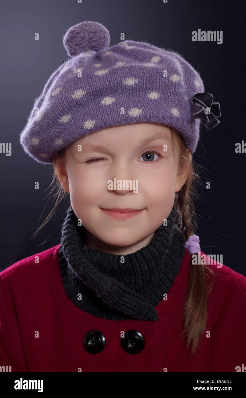 Little girl winking Stock Photo - Alamy