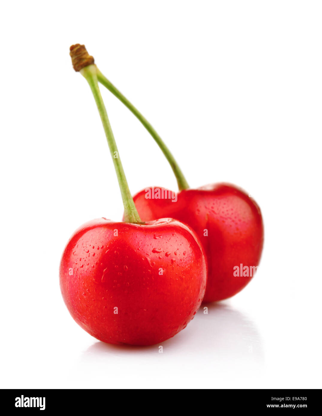 Ripe red cherry berries isolated on white Stock Photo - Alamy