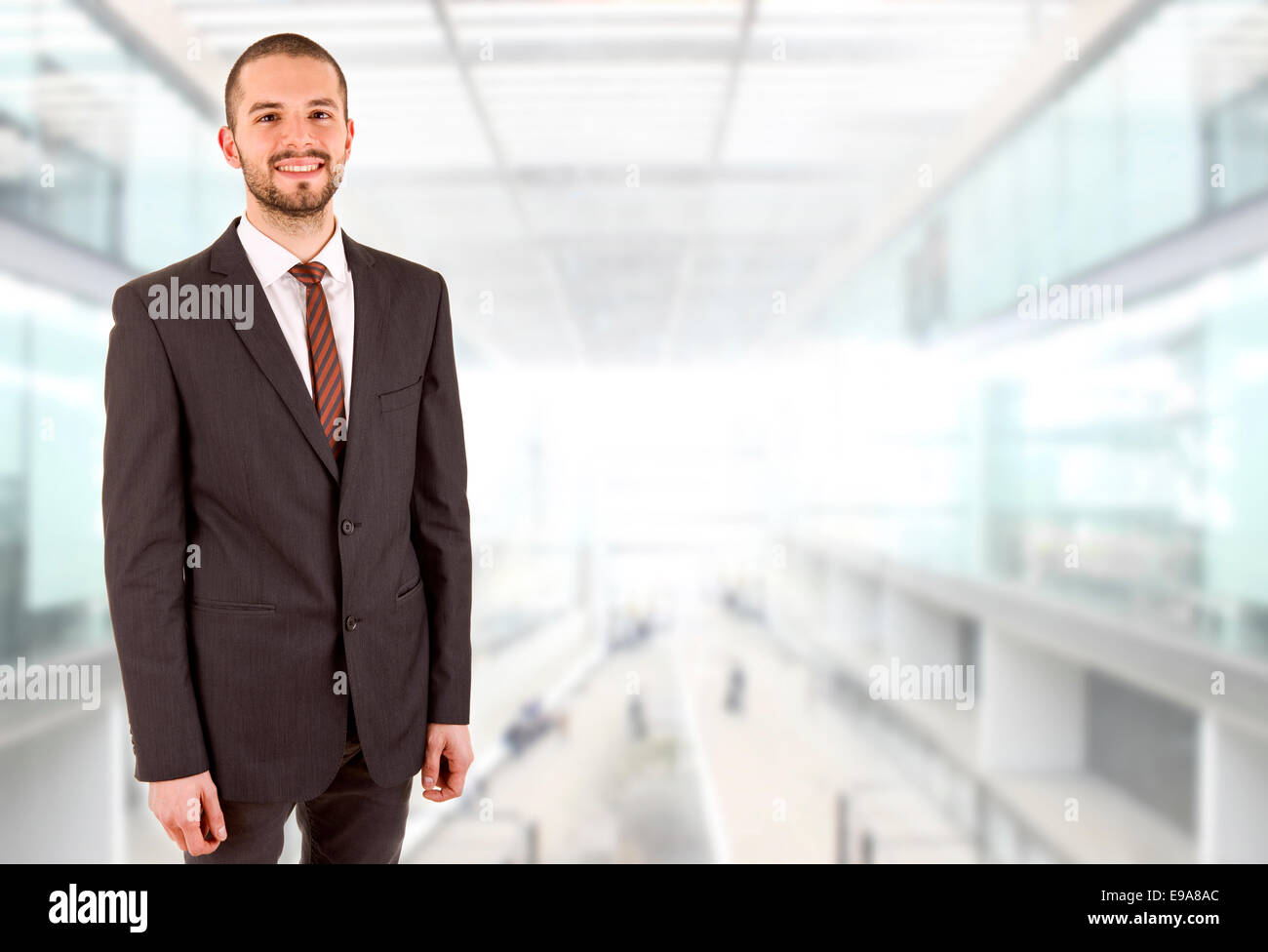 young happy business man at the office Stock Photo - Alamy